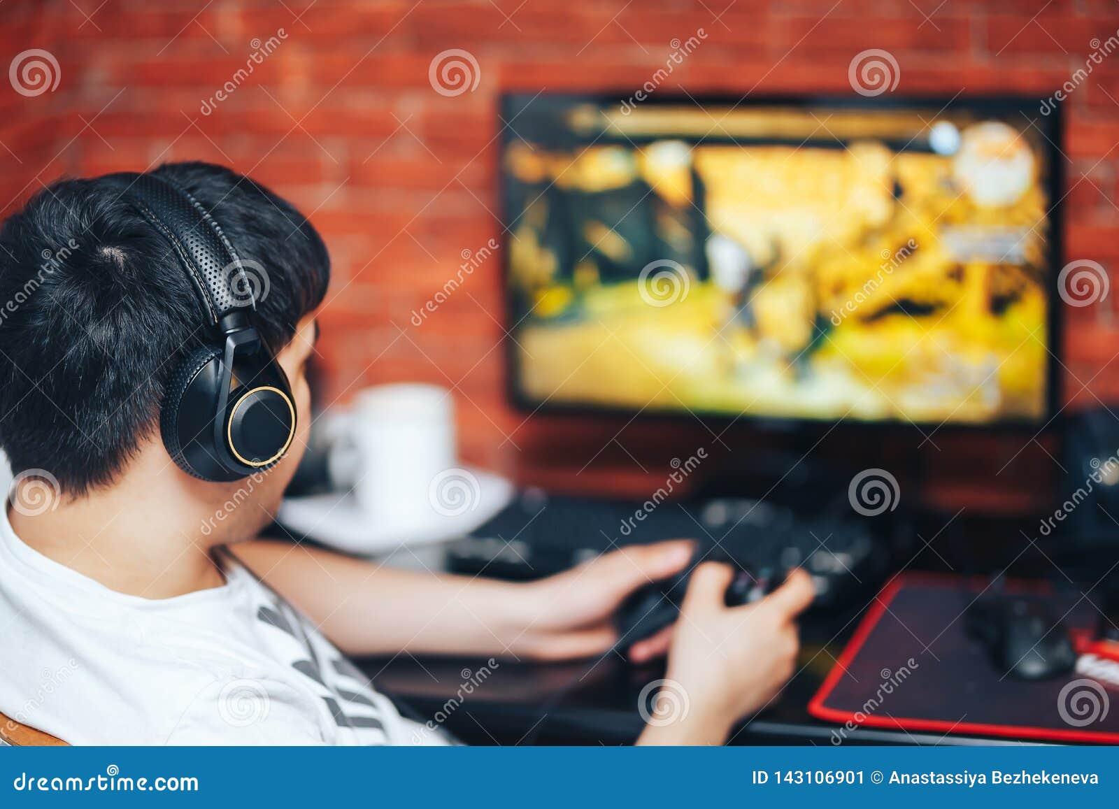 Man Playing a Computer Games in Headphones and Console Stock Image ...