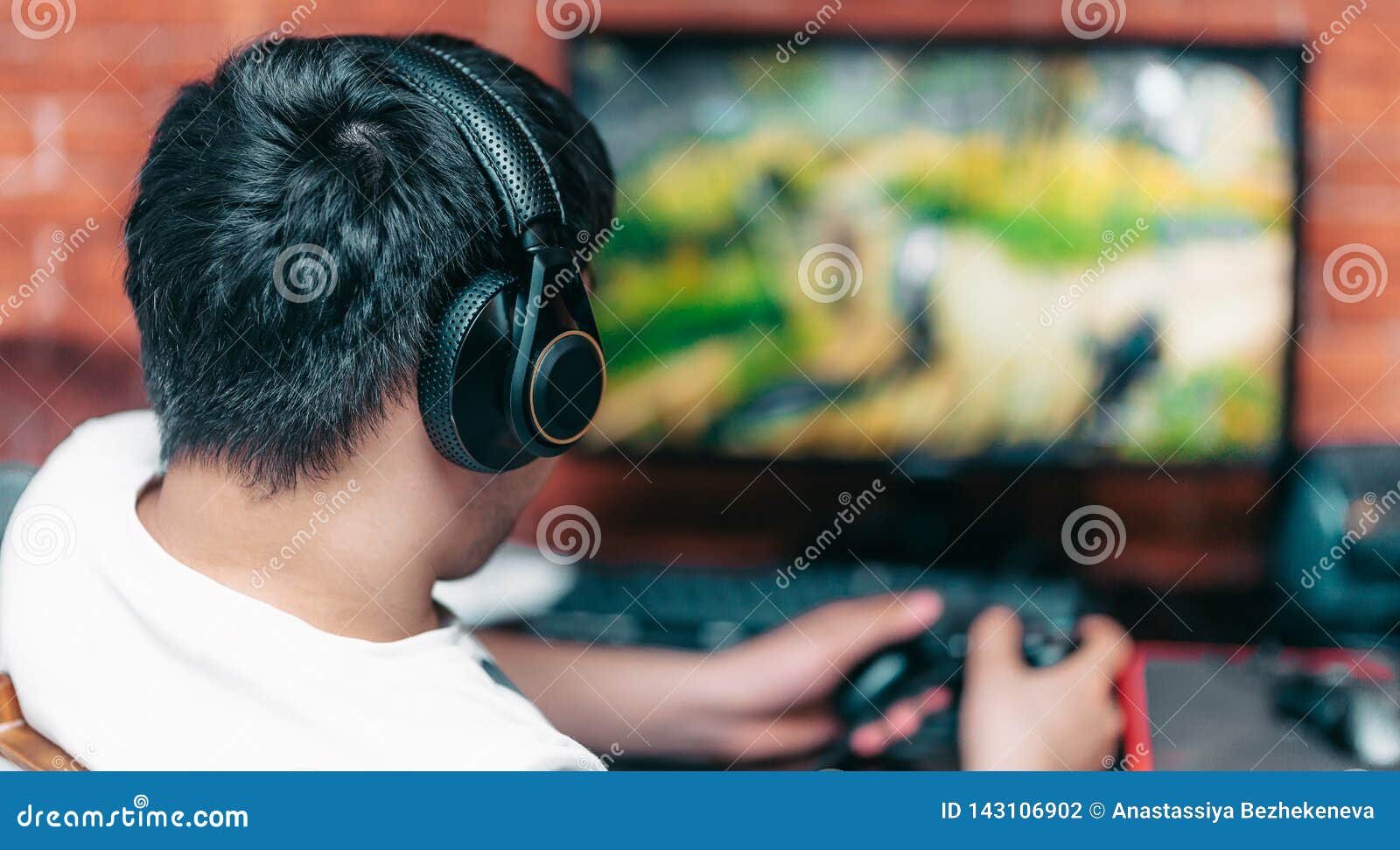 Man Playing a Computer Games in Headphones and Console Stock Photo ...