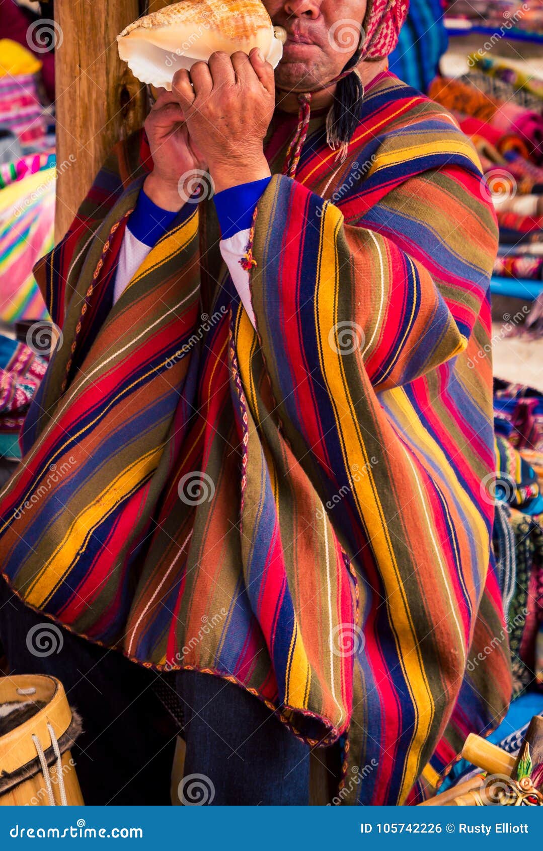 Man playing a conch shell editorial photo. Image of clothing - 105742226