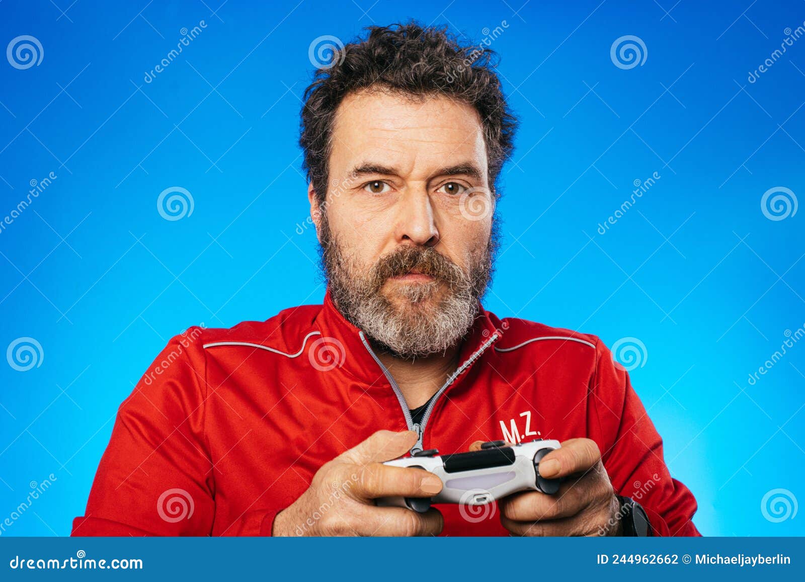 Man Playing with Controller, Portraits on Blue Background Stock Photo ...