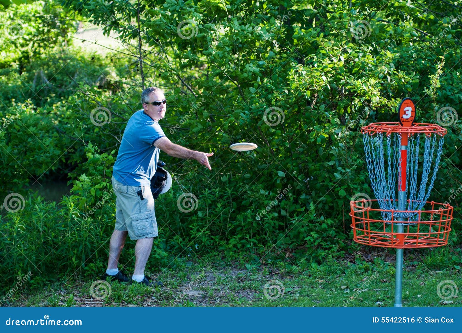 Man playing dics golf stock photo. Image of sport, aged - 55422516
