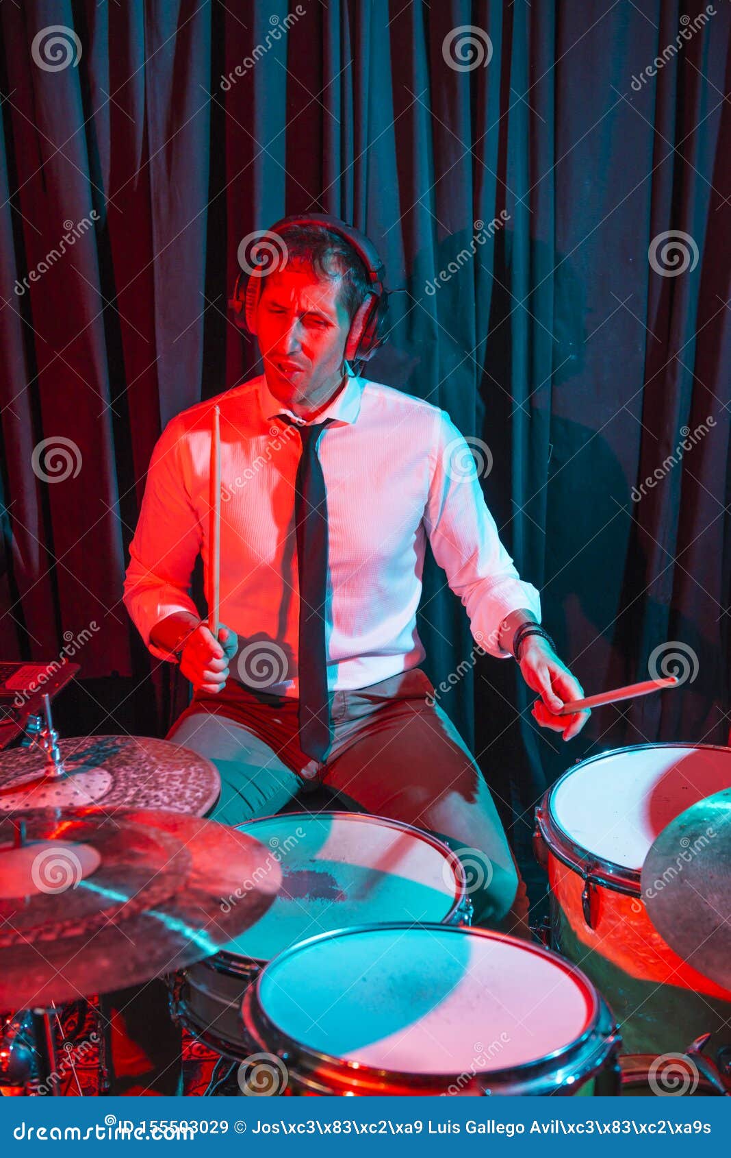 Man playing the drums stock image. Image of performer - 155503029
