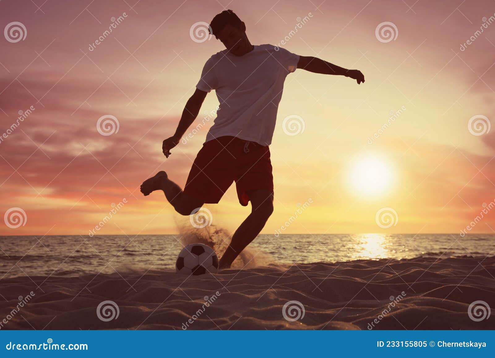 Man Playing Football on Beach at Sunset Stock Image - Image of ocean ...
