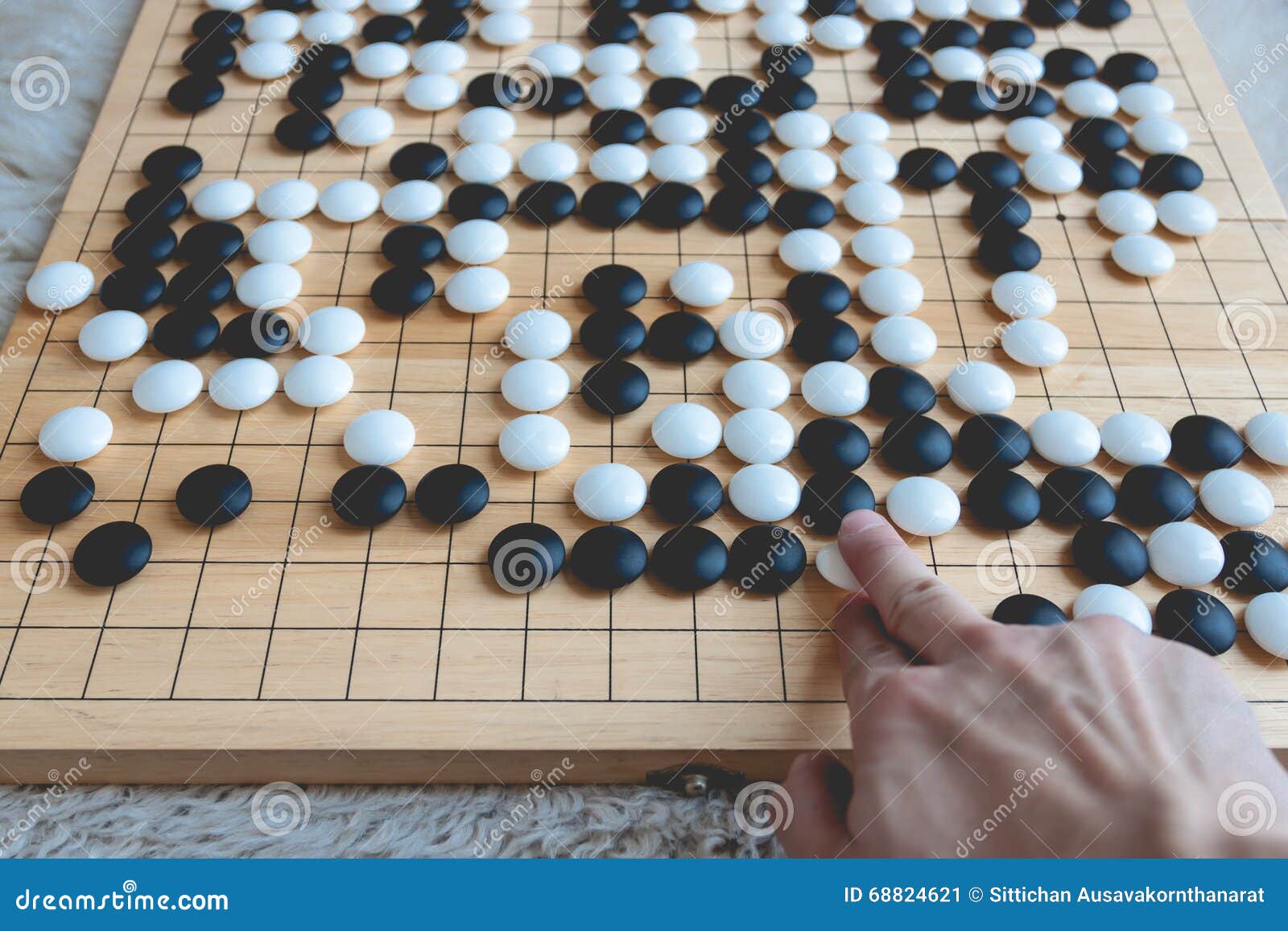 Man playing Go board game stock image. Image of activity - 68824621