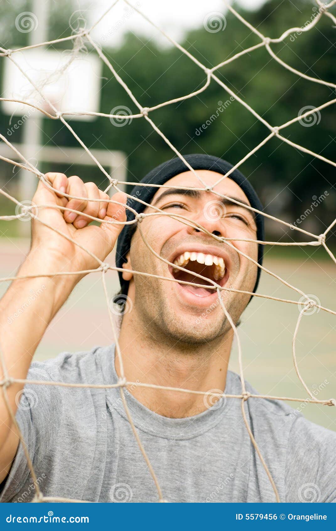Man Playing with Goalie Soccer Net - Vertical Stock Photo - Image of ...