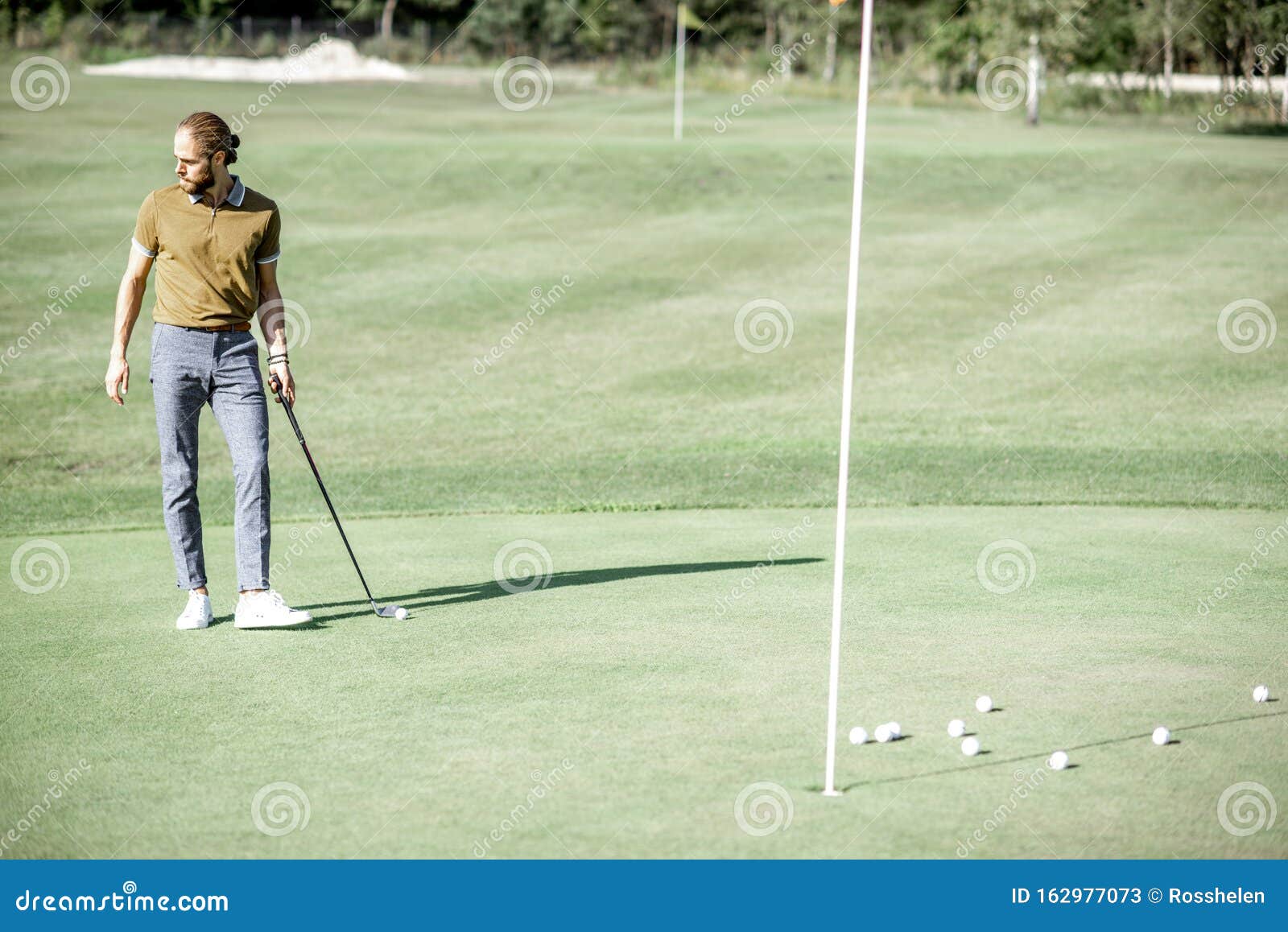 Man playing golf outdoors stock image. Image of ball - 162977073