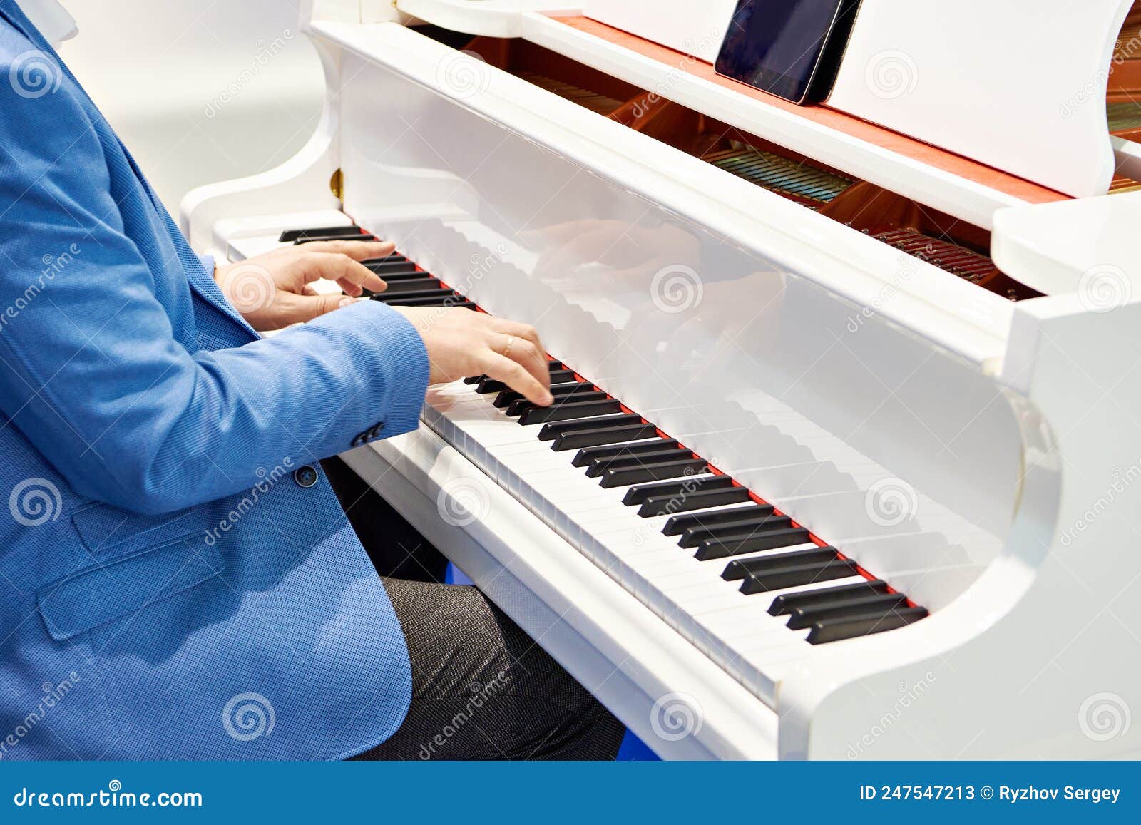 Man playing grand piano stock image. Image of musical - 247547213