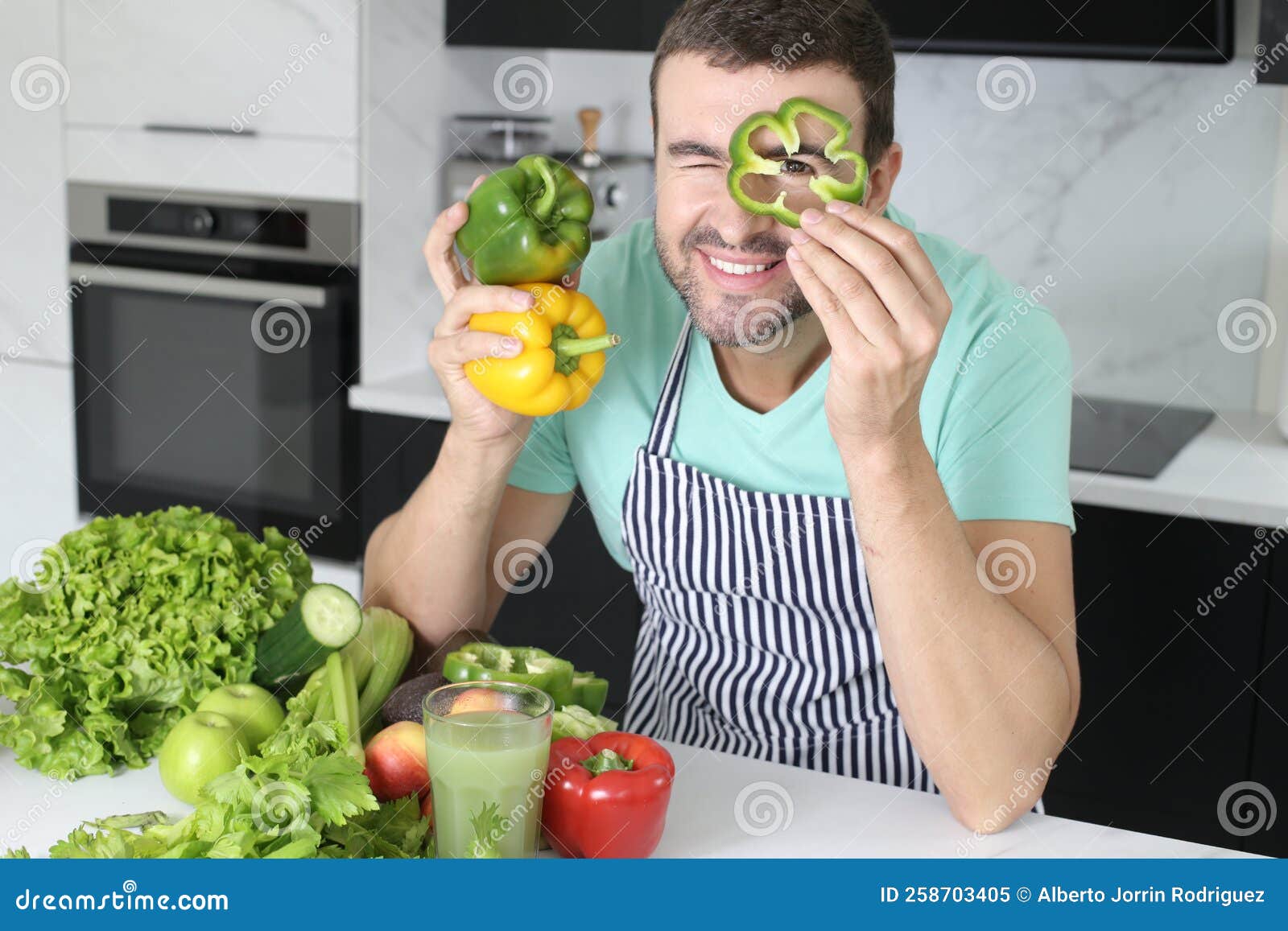 Man Playing with Green Bell Peppers in the Kitchen Stock Image - Image ...