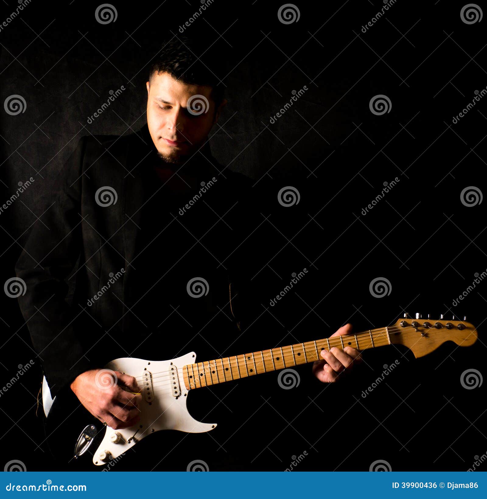 A man playing the guitar stock photo. Image of casual - 39900436