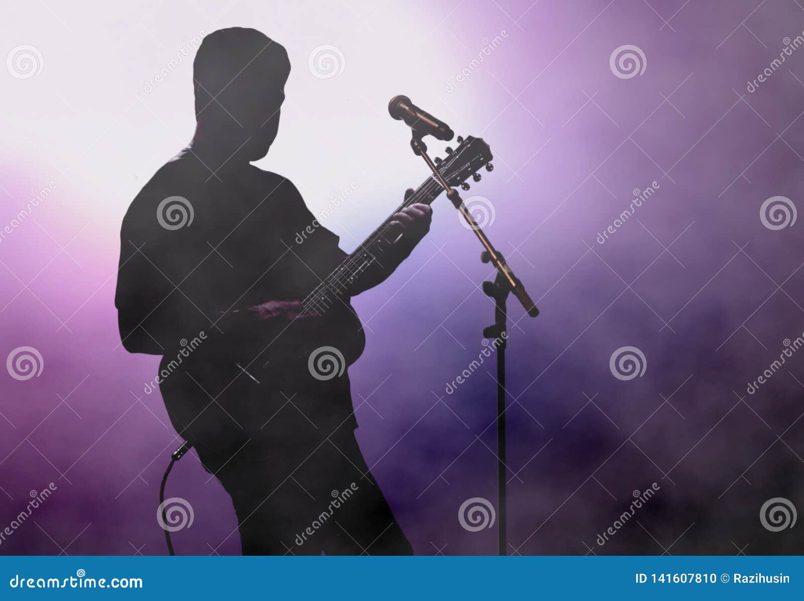 Man Playing Guitar Under Spotlight on Stage Stock Photo - Image of ...