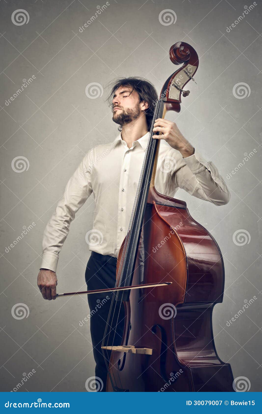 Man playing a double bass stock image. Image of face - 30079007