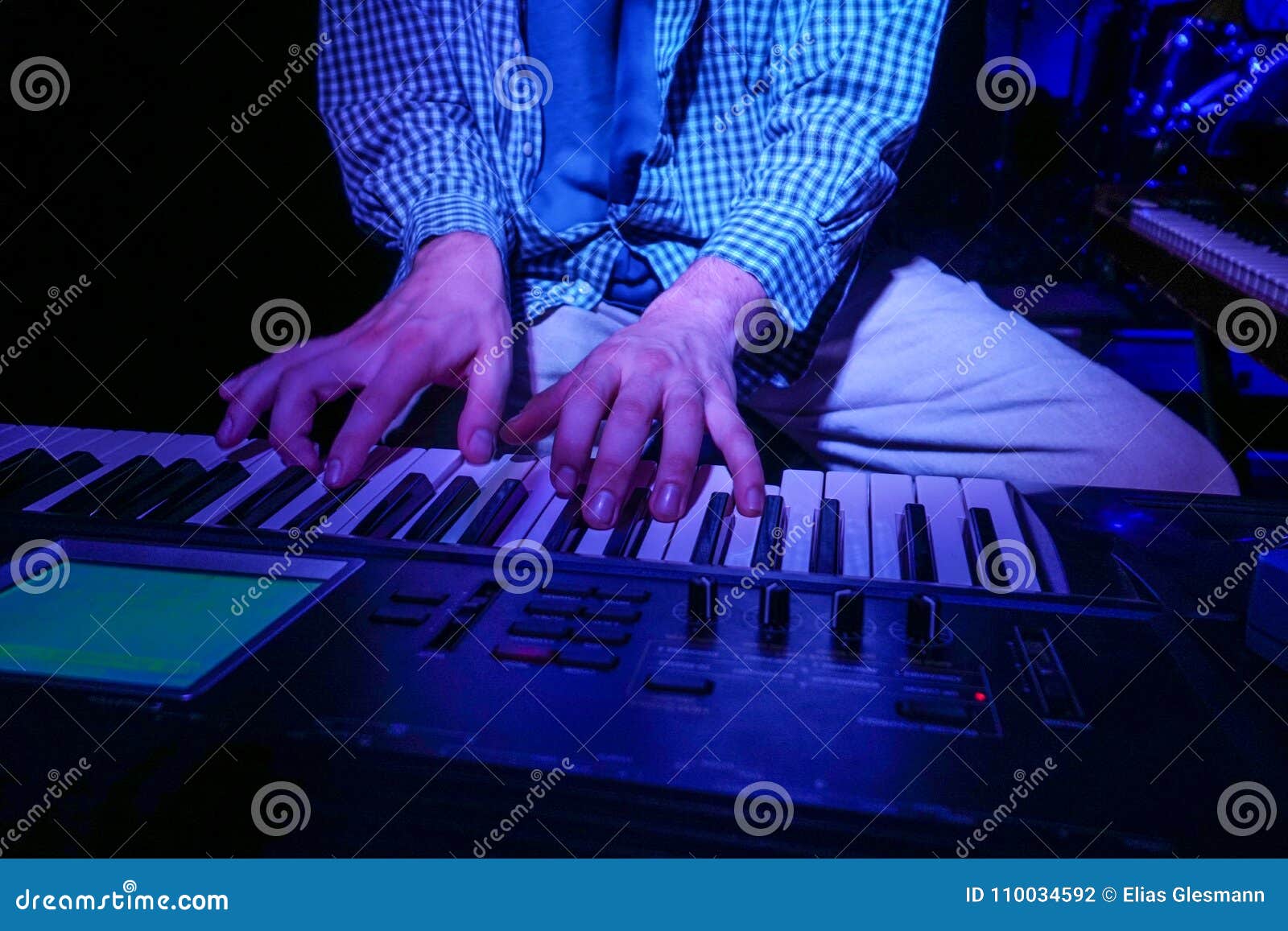 Man Playing the Keyboard stock photo. Image of person - 110034592