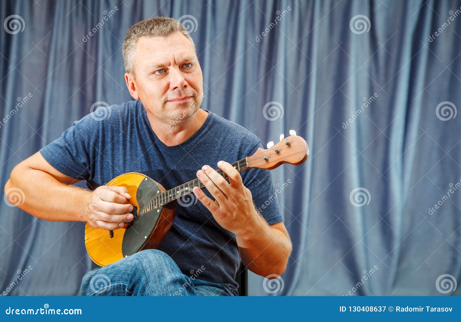 Man playing the mandolin stock image. Image of entertainment - 130408637