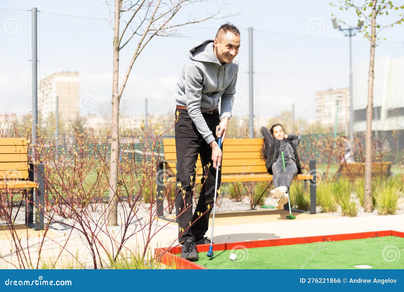 Man Playing Mini Golf. Summer Season Game Stock Photo - Image of ...