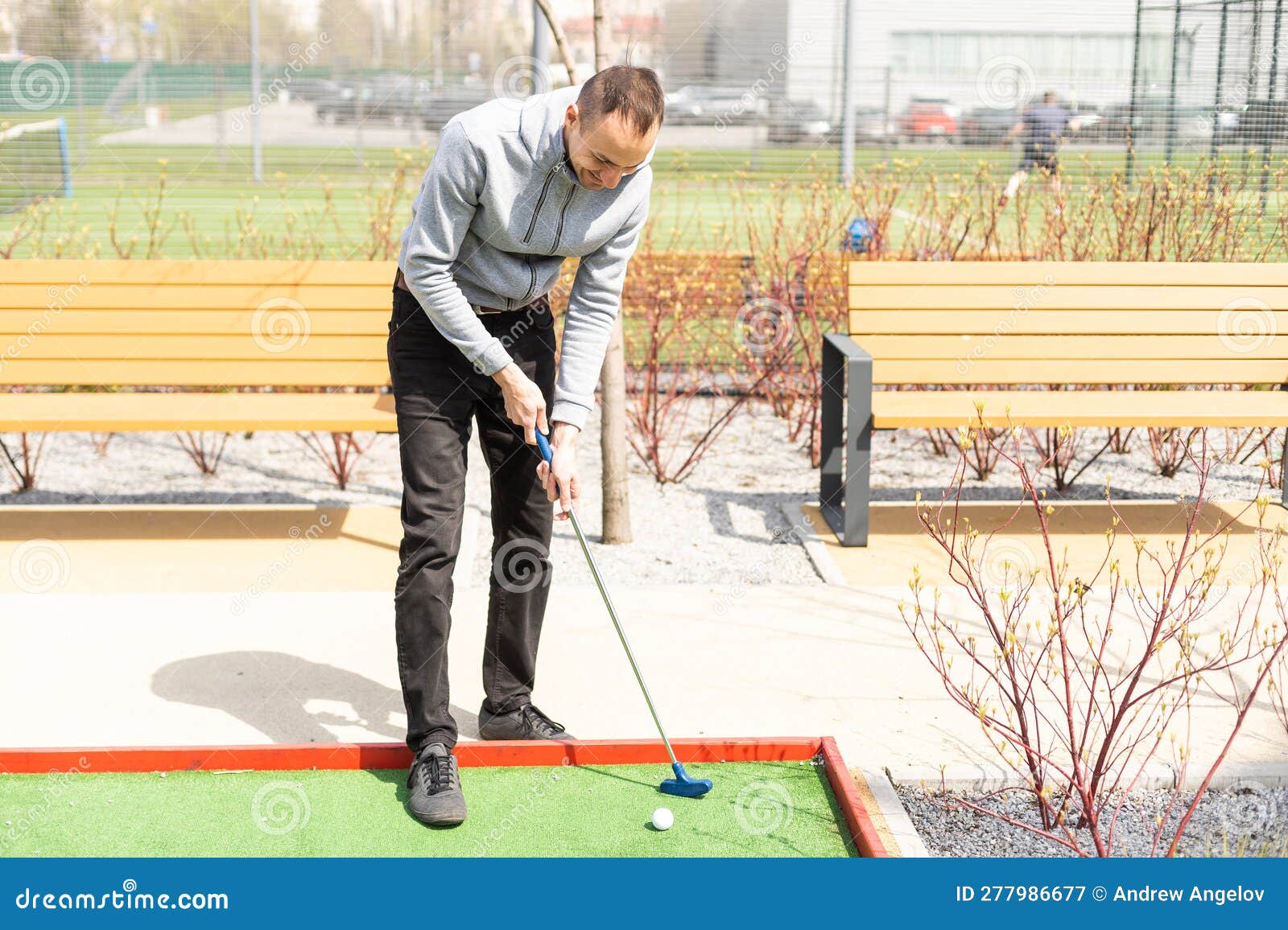 Man Playing Mini Golf. Summer Season Game Stock Image - Image of game ...