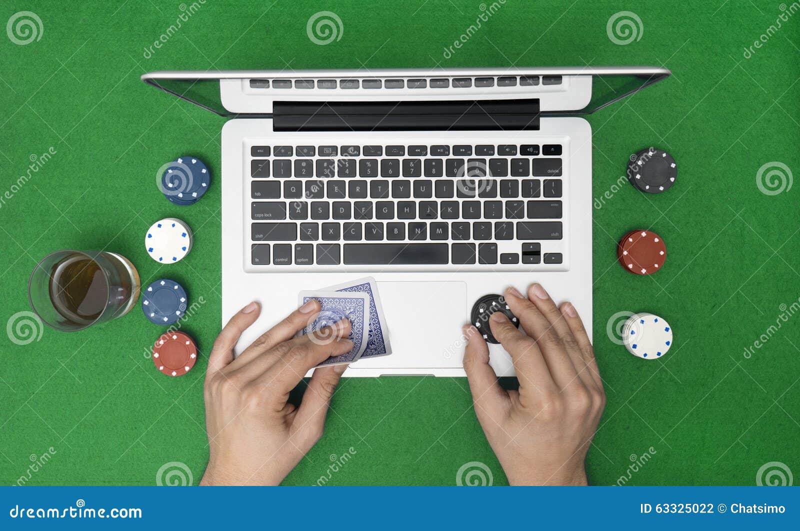 Man Playing Online Poker with Laptop on a Green Table with Chips Stock ...
