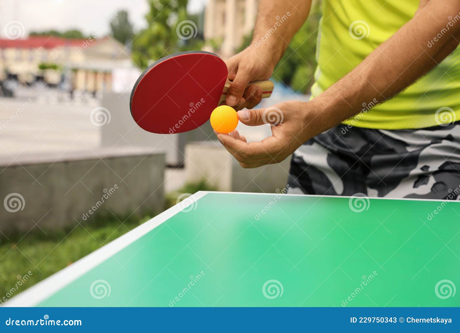 Man Playing Ping Pong Outdoors on Summer Day, Closeup Stock Image ...