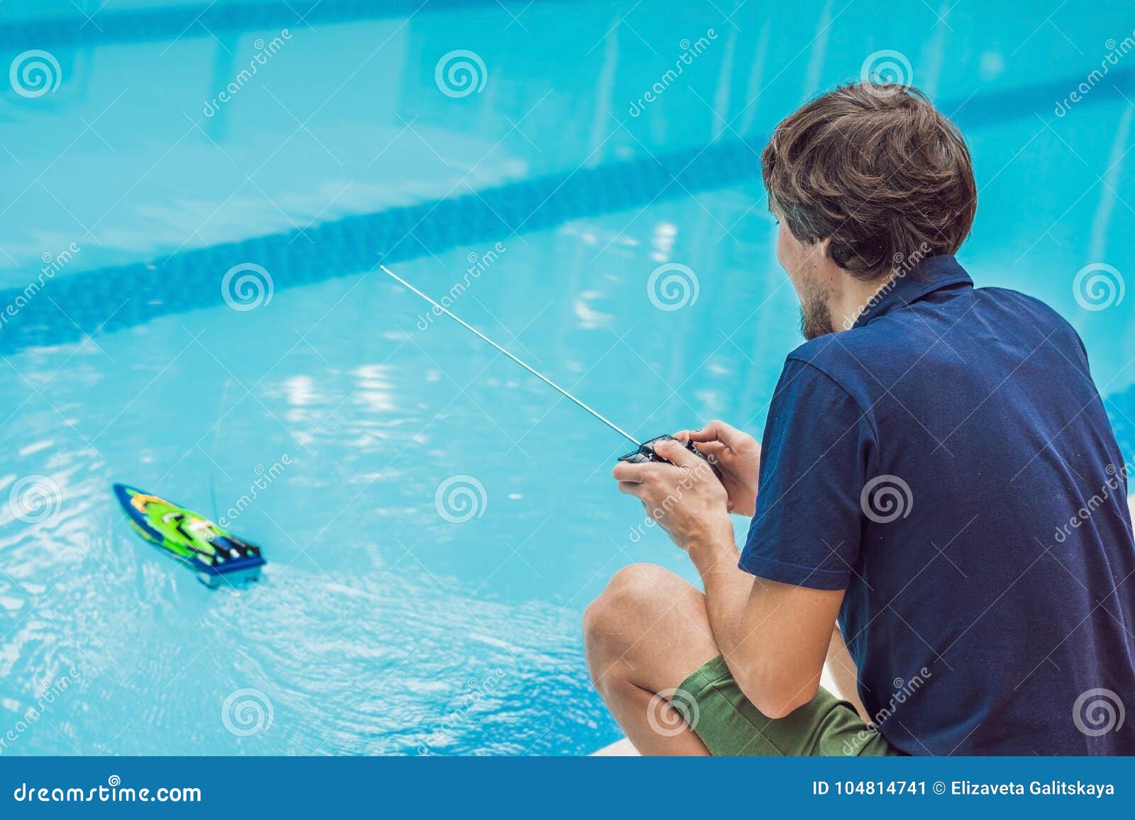Man Playing with a Remote Controlled Boat in the Pool Stock Image ...