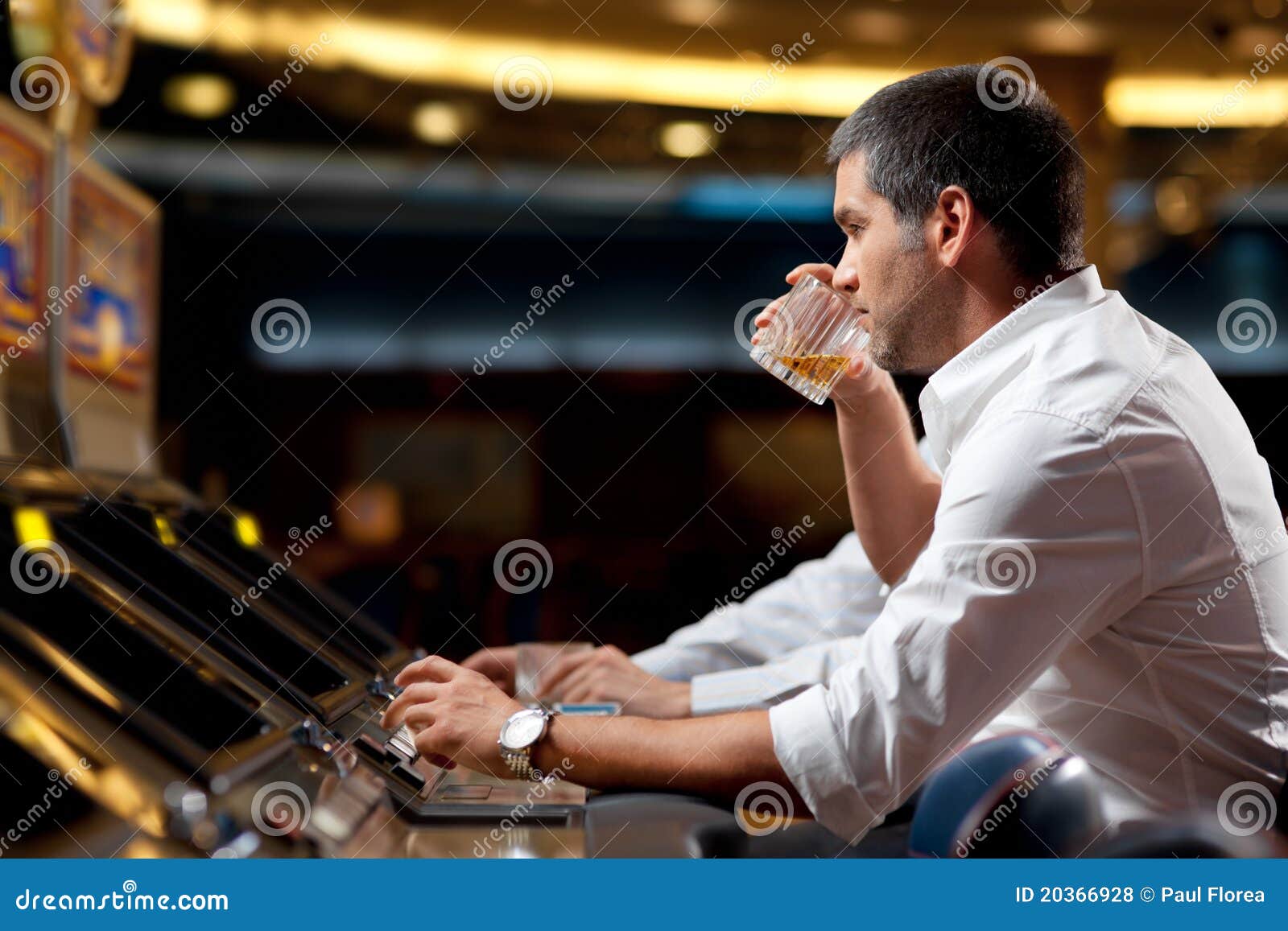 Man Playing the Slot Machine Stock Photo - Image of casino, horizontal ...
