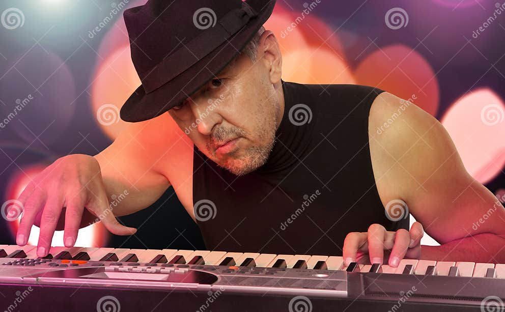 Man playing synthesizer stock photo. Image of concert - 61511916