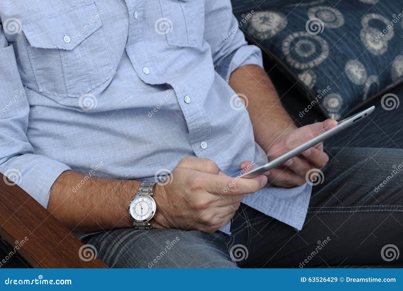 Man playing on a tablet stock image. Image of playing - 63526429