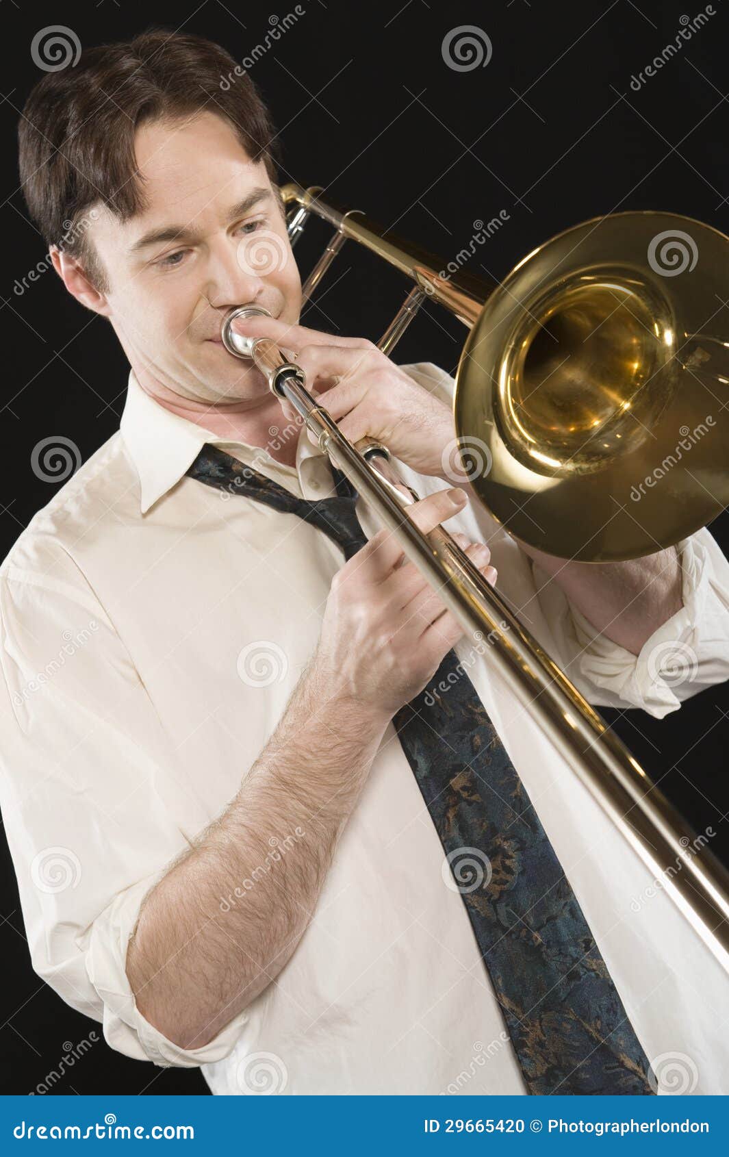 Man Playing Trombone stock photo. Image of holding, percussion - 29665420
