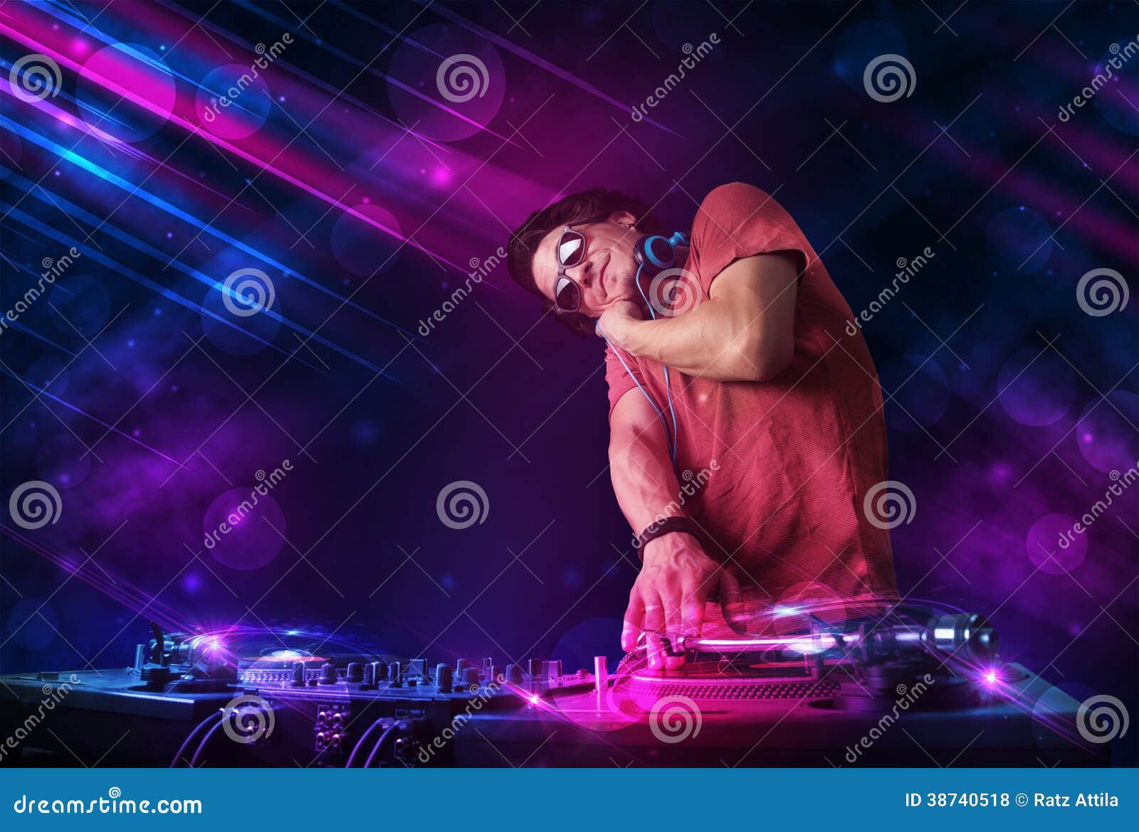 Man Playing on Turntables with Color Light Effects Stock Photo - Image ...