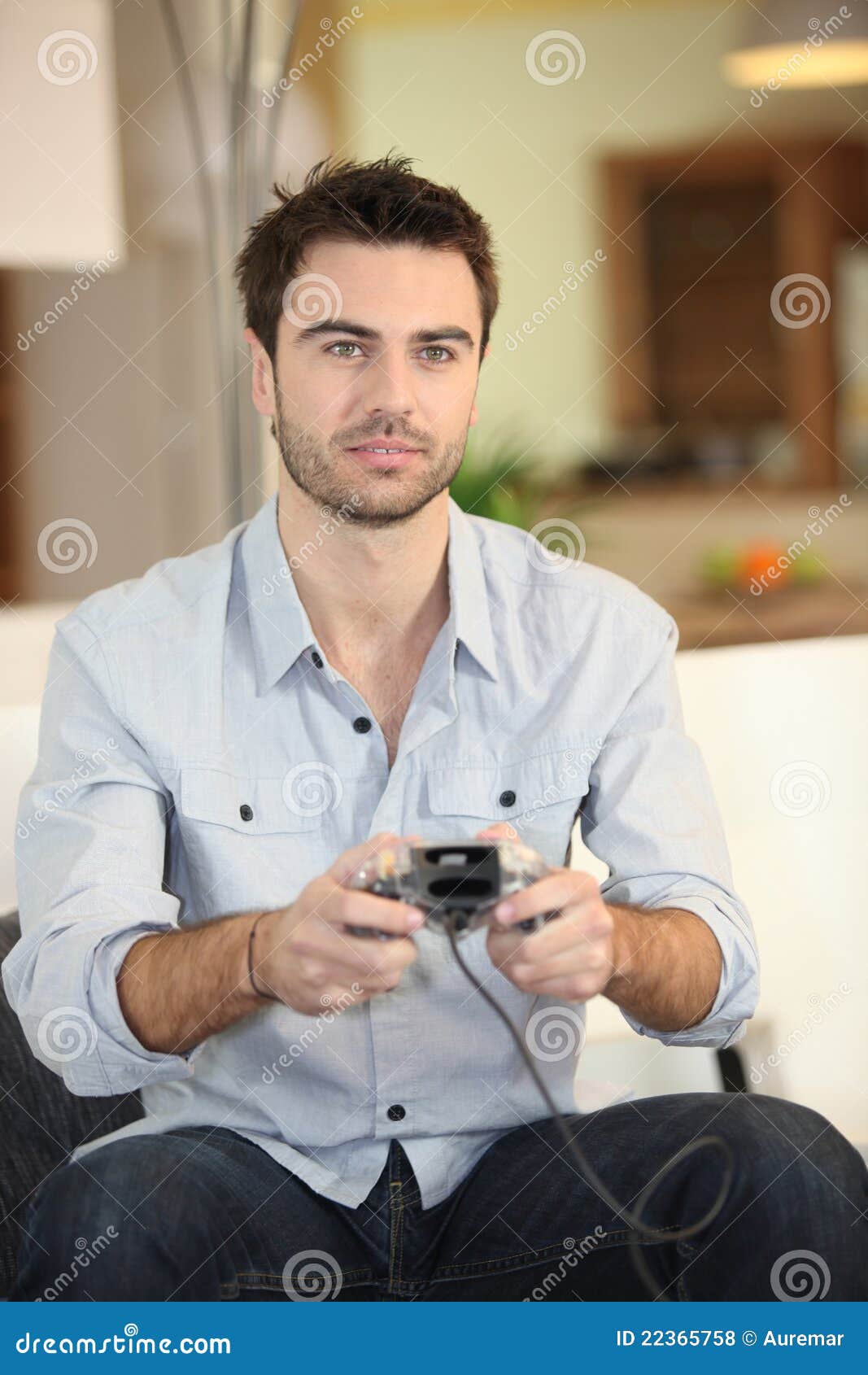 Man playing a video game stock photo. Image of enthralled - 22365758