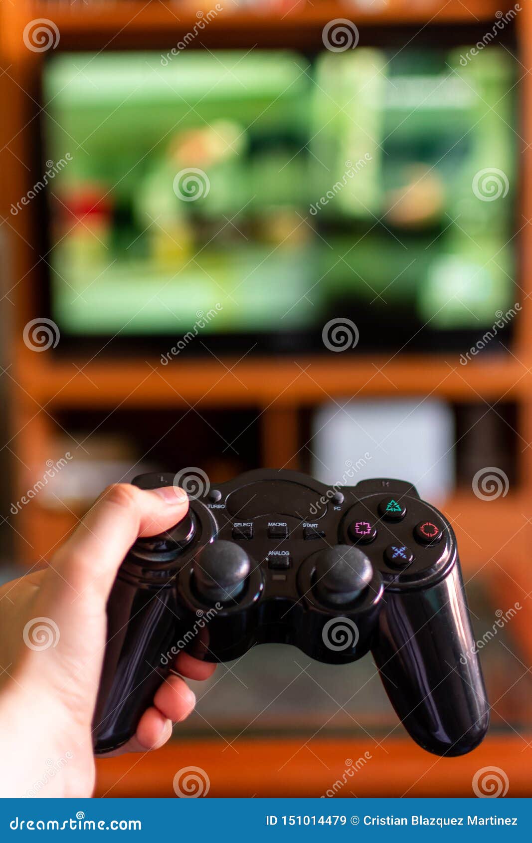 Man Playing with a Video Game Controller in His Hands. Focus on the ...