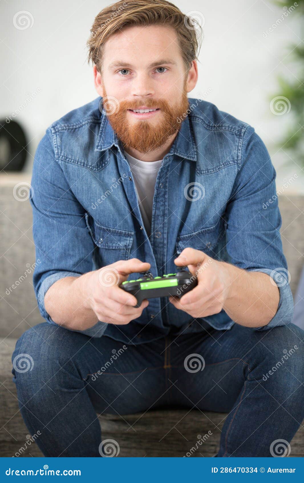 Man playing video games stock photo. Image of leisure - 286470334