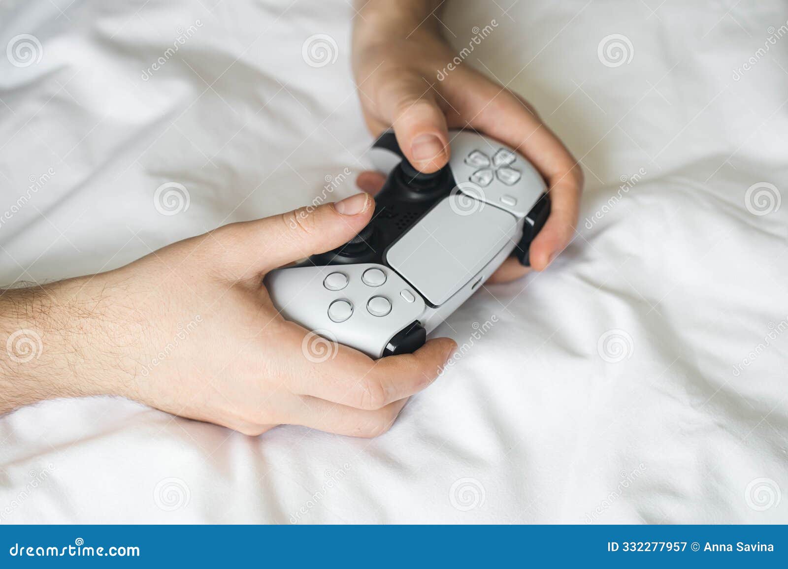 Man Playing Video Games with Game Controller while Lying in Bed. Stock ...
