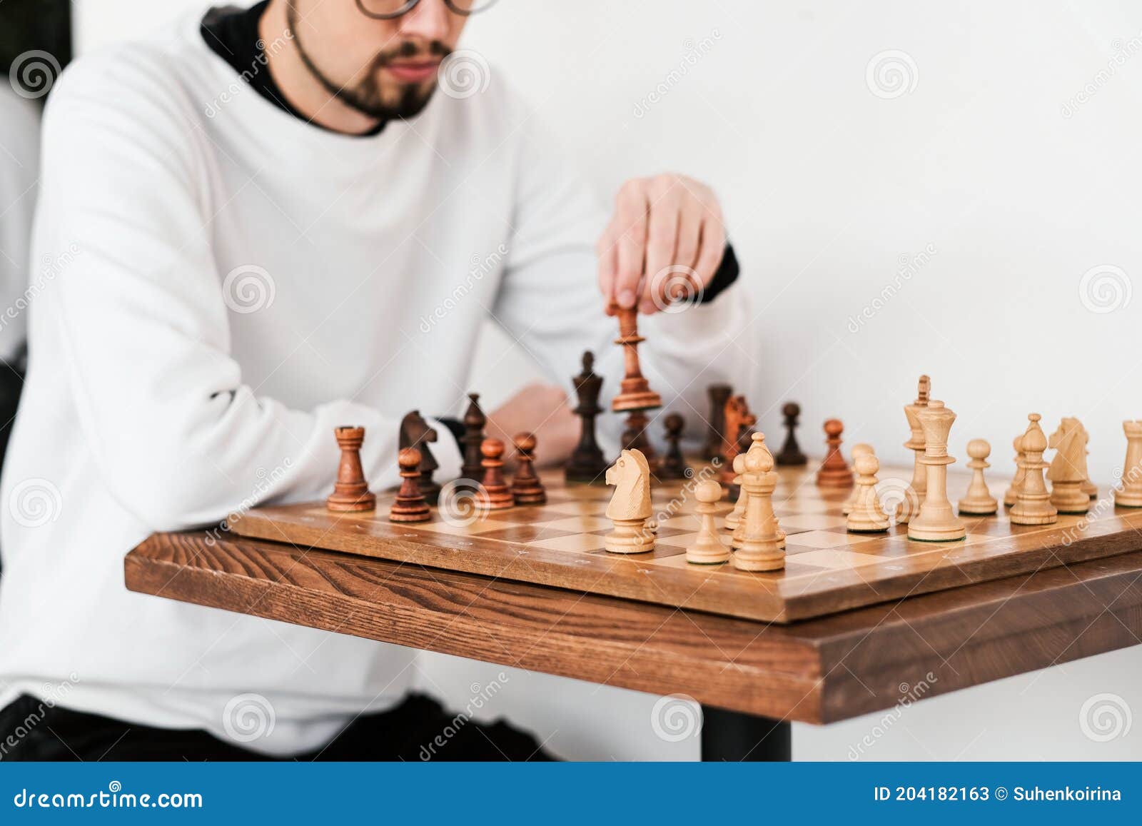Man Plays Chess on Isolation. Chess Board. Game of Chess on a White ...