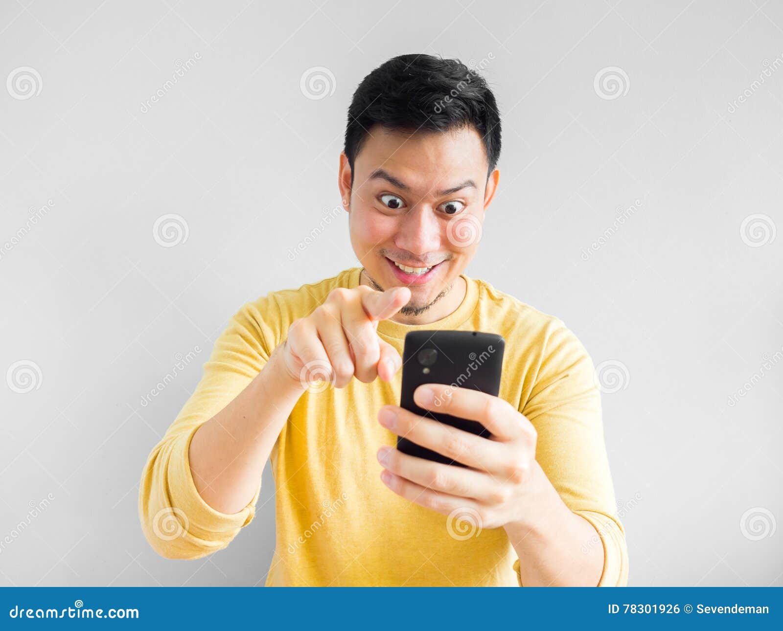 Man plays mobile game. stock photo. Image of reaction - 78301926