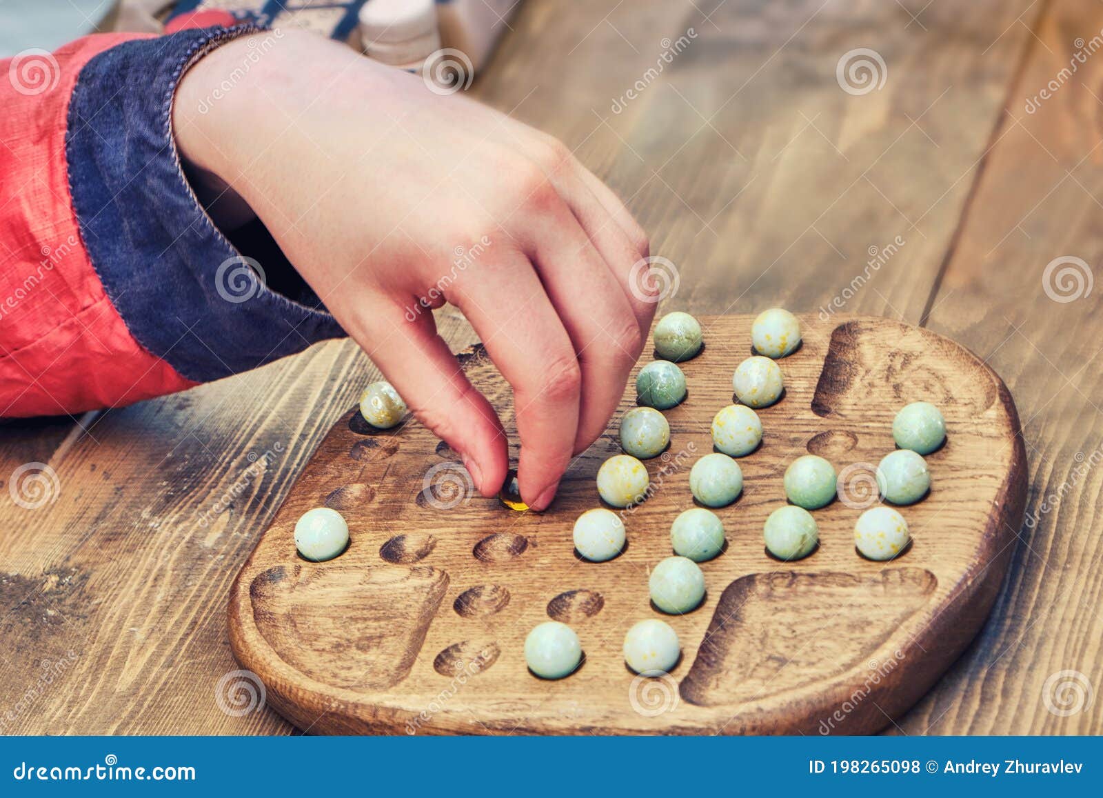A Man Plays a Retro Board Game Mill. an Old Intellectual Game for Two ...