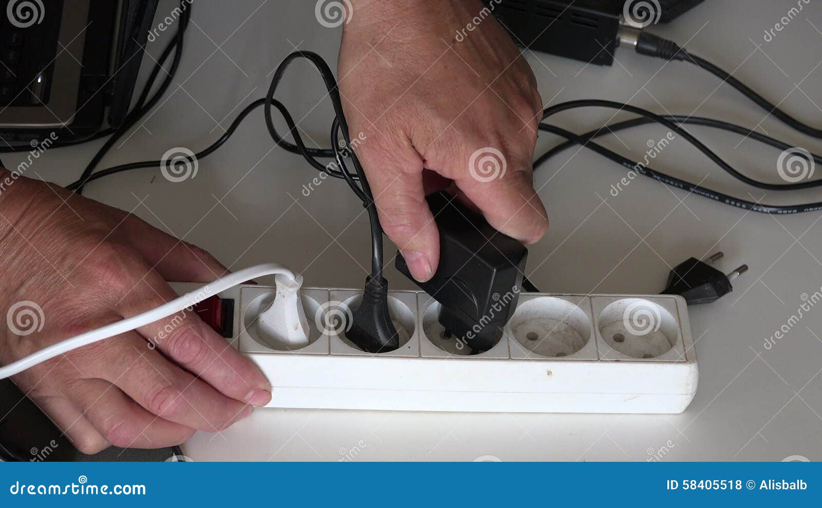 Man Plugging in Appliances in Extension Cord, 4K Stock Footage - Video ...