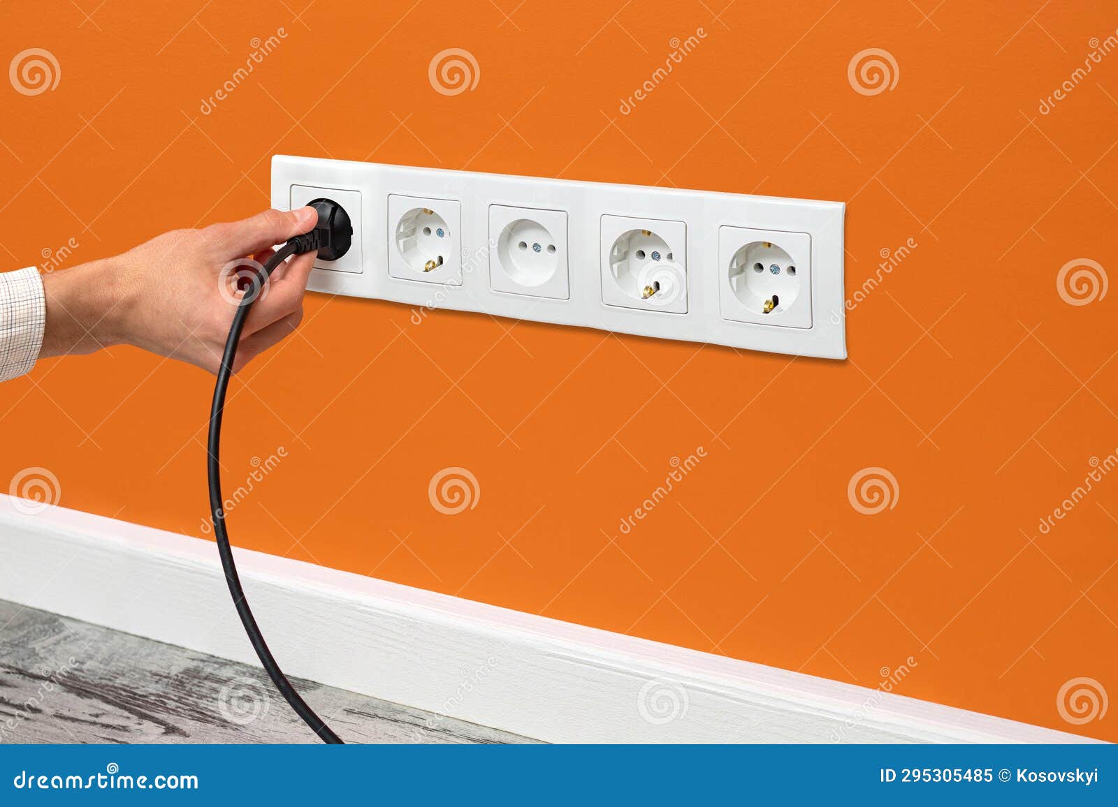 Man Plugging Cord into a Electrical Outlet Stock Image - Image of ...