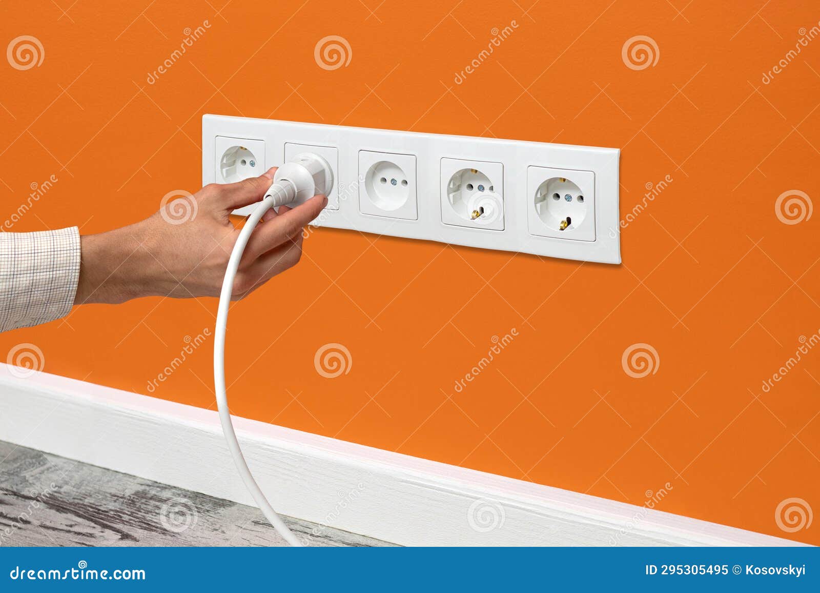 Man Plugging Cord into a Electrical Outlet Stock Image - Image of ...