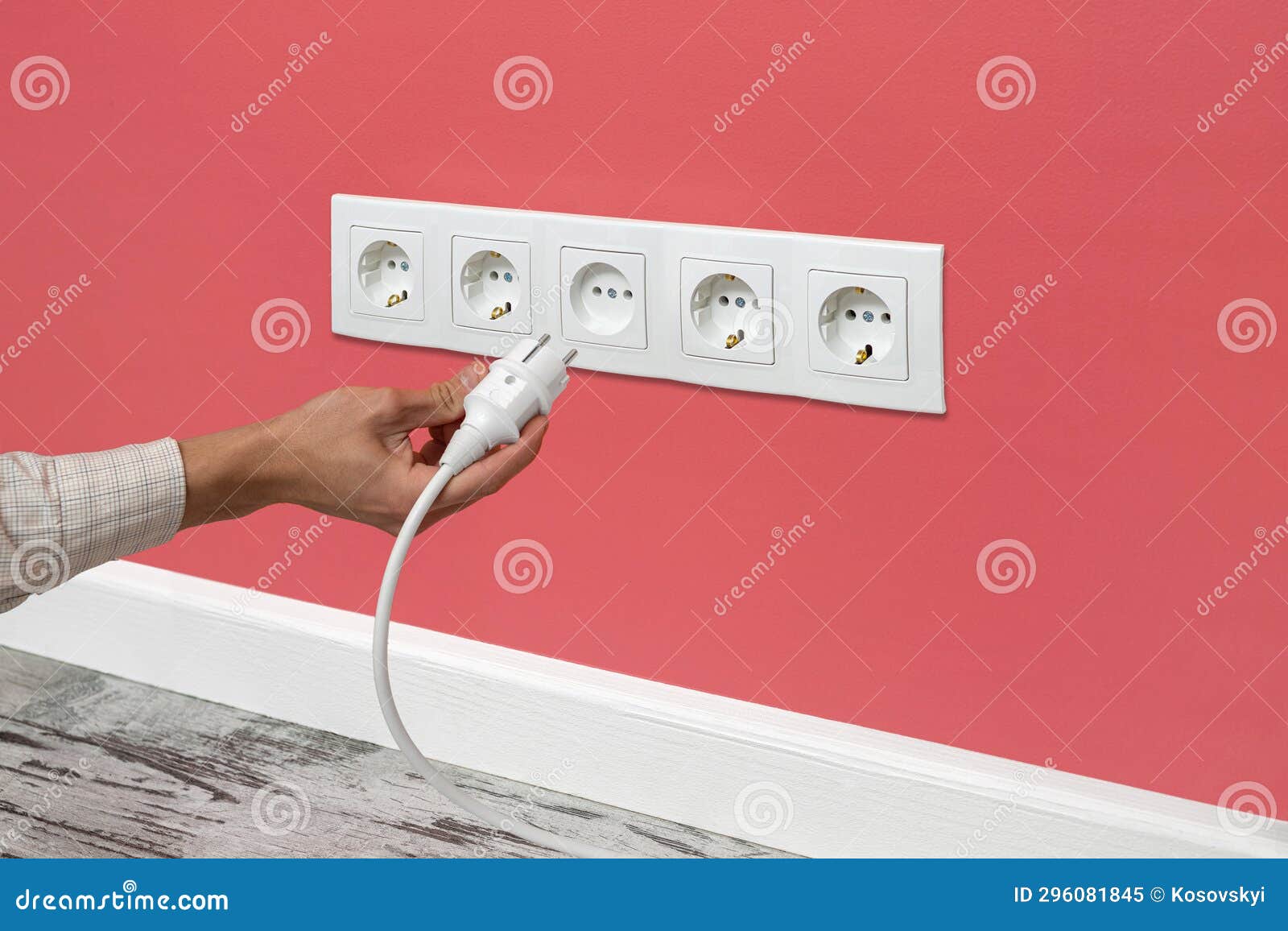 Man Plugging Cord into a Electrical Outlet Stock Image - Image of plug ...
