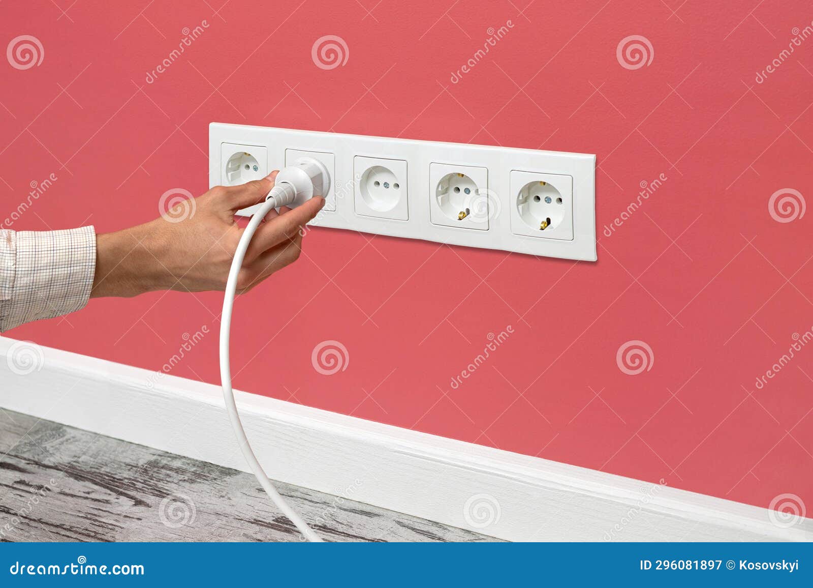 Man Plugging Cord into a Electrical Outlet Stock Image - Image of ...