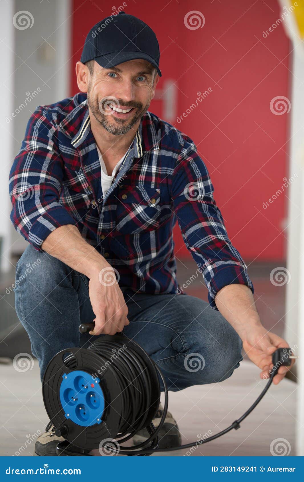 Man Plugging in Extension Lead on Reel Stock Image - Image of cable ...