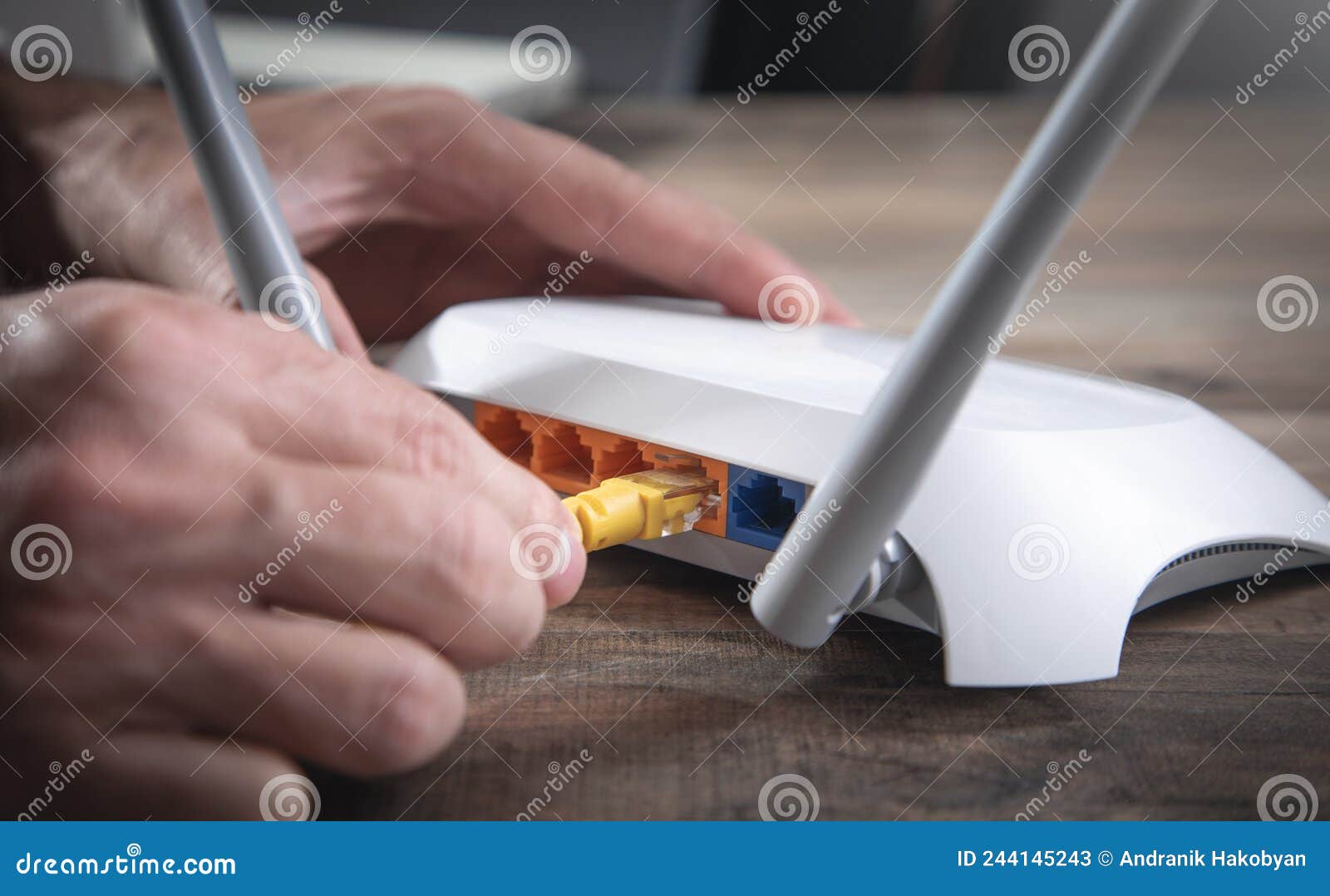Man Plugging Internet Cable into Wifi Router Stock Image - Image of ...