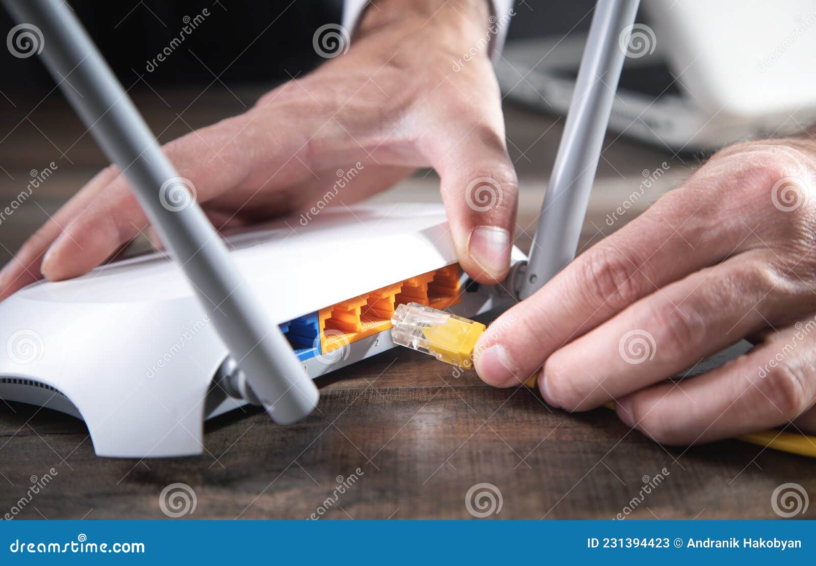 Man Plugging Internet Cable into Wifi Router Stock Image - Image of ...