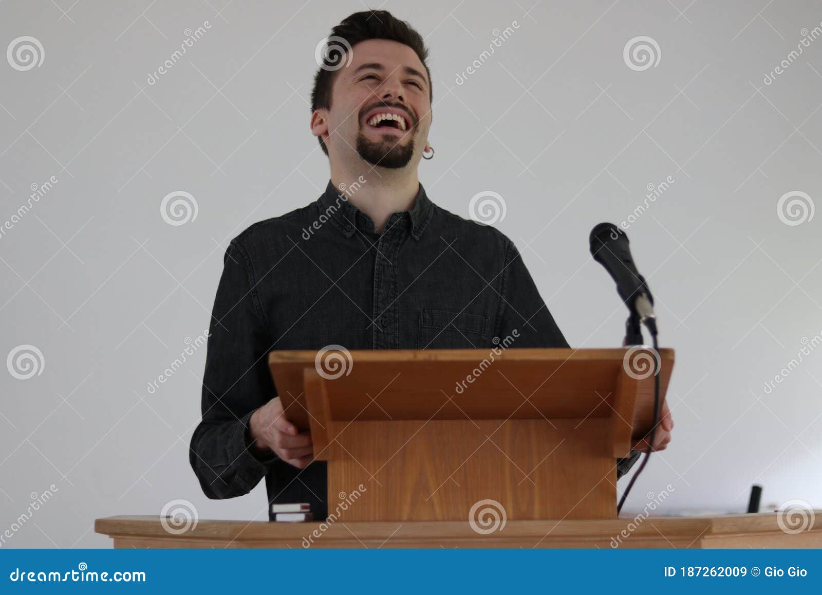 Man on a Podium Laughing stock image. Image of podium - 187262009