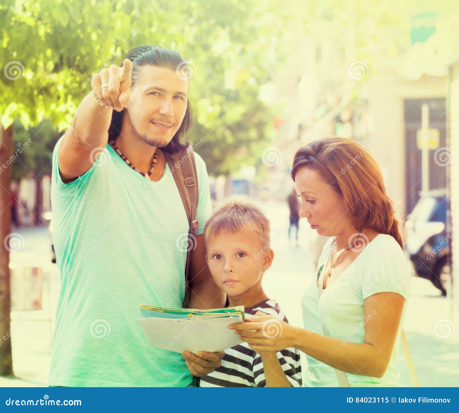 Man Pointing the Direction for Family Stock Image - Image of city, girl ...
