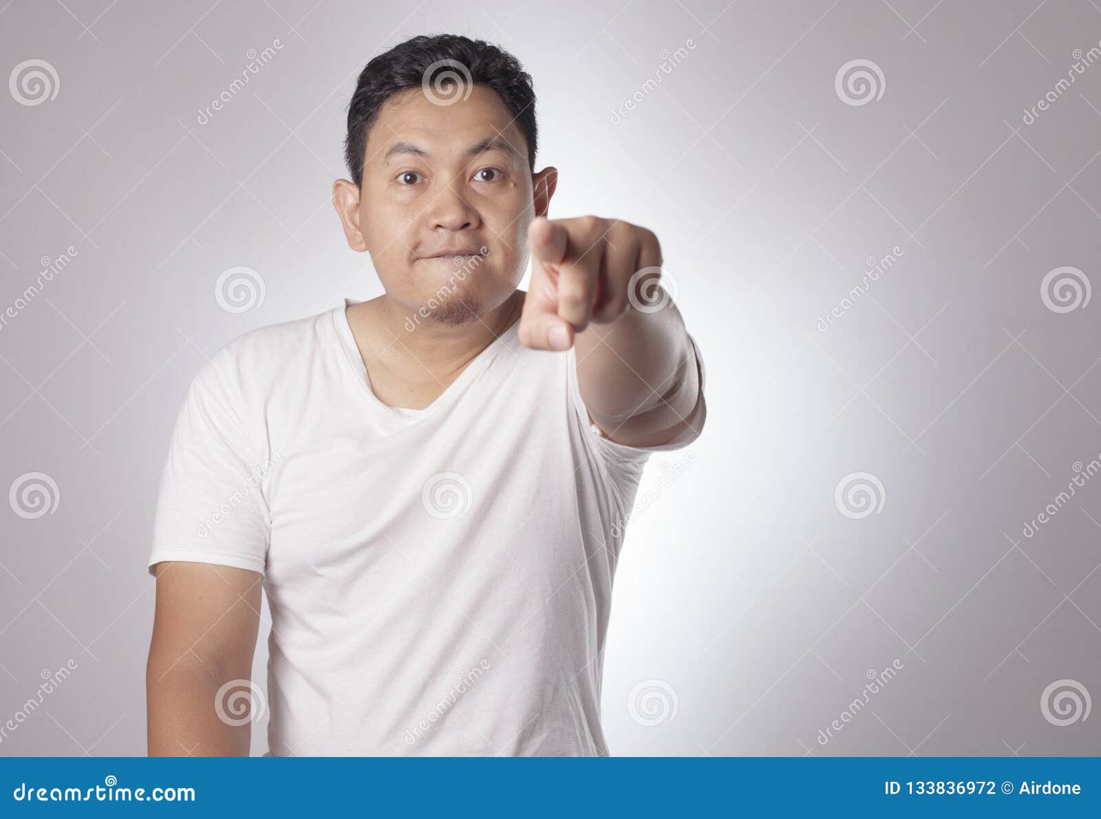 Man Pointing Forward, Looking at Camera Stock Photo - Image of happy ...