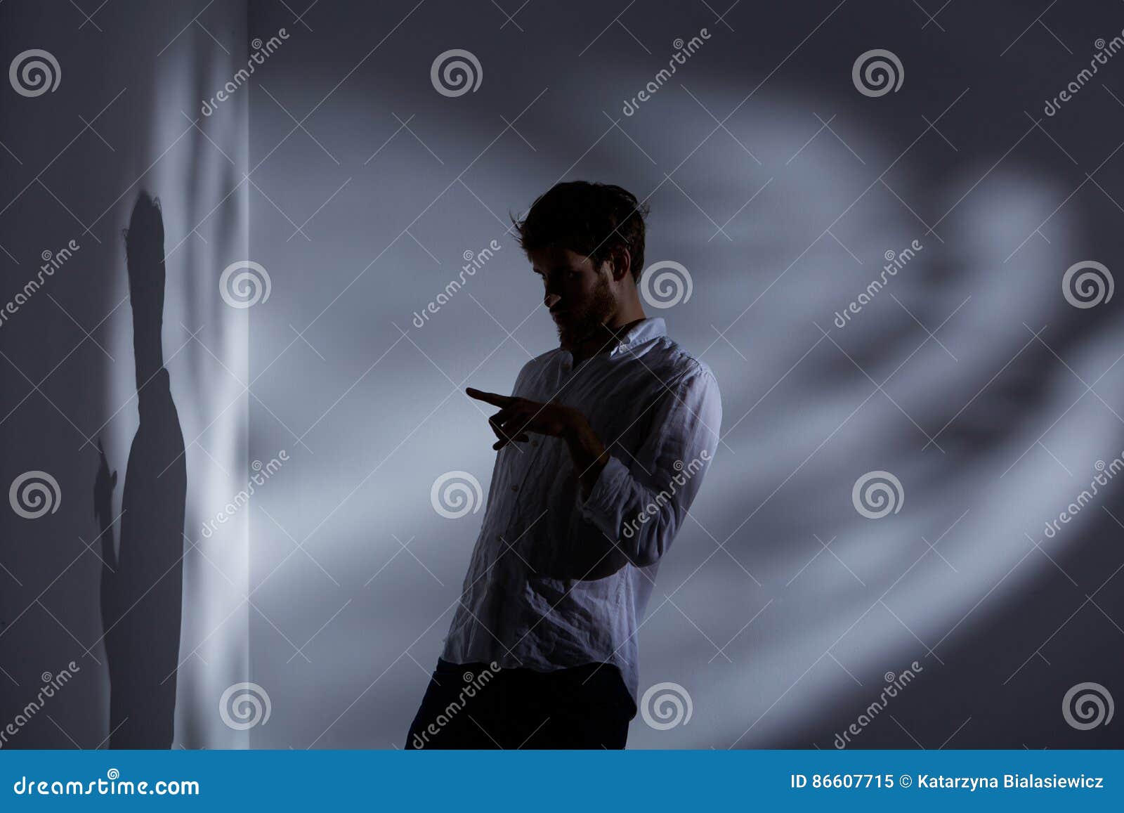 Man pointing his shadow stock image. Image of grief, individual - 86607715
