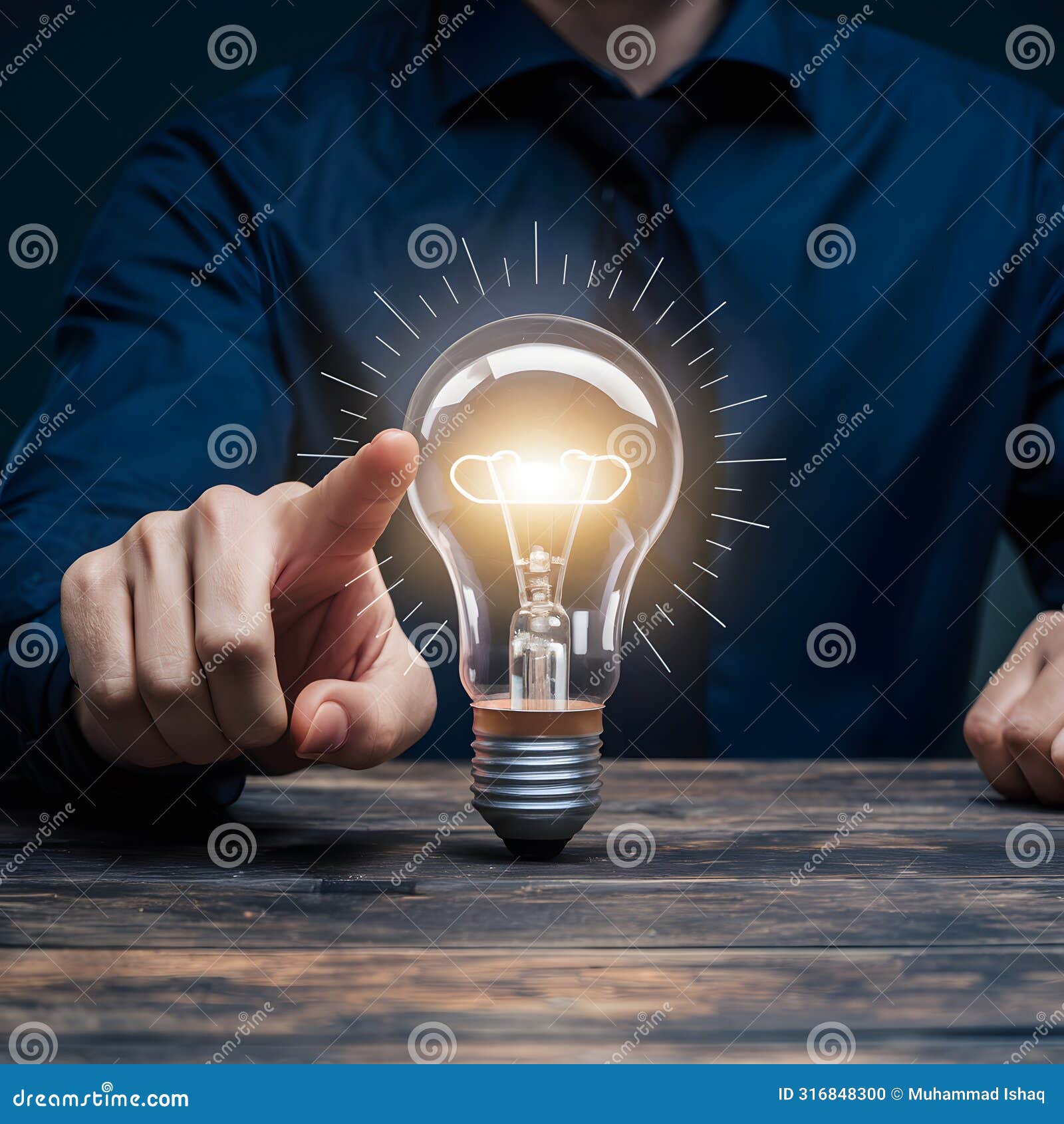 Man Pointing at Light Bulb on Table, Symbolizing New Idea Concept and ...
