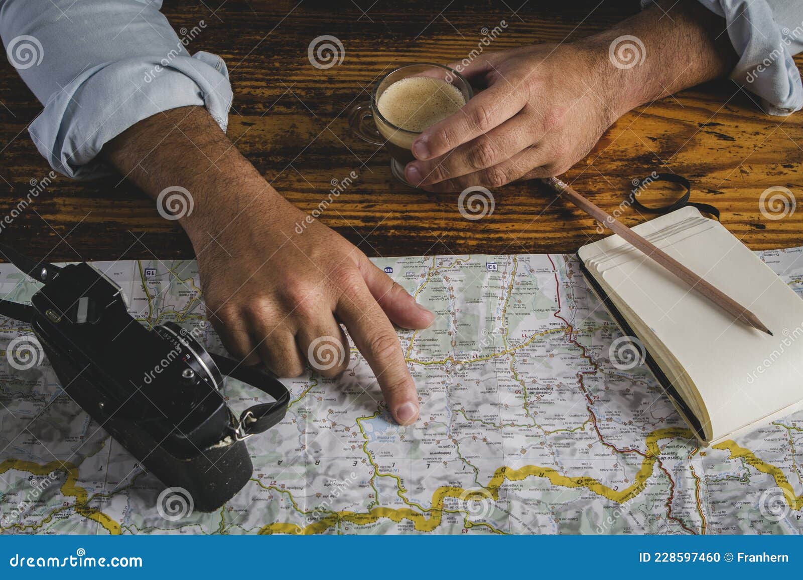 Man pointing at map stock photo. Image of camera, drink - 228597460