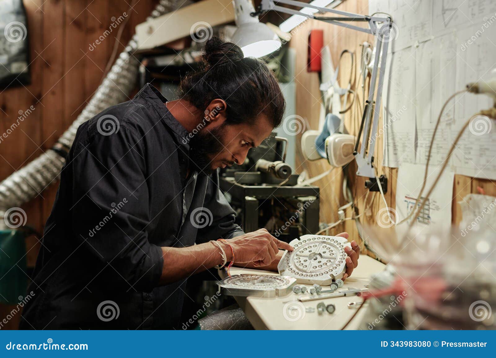 Man Pointing at Press Mold by Workbench Stock Photo - Image of ...