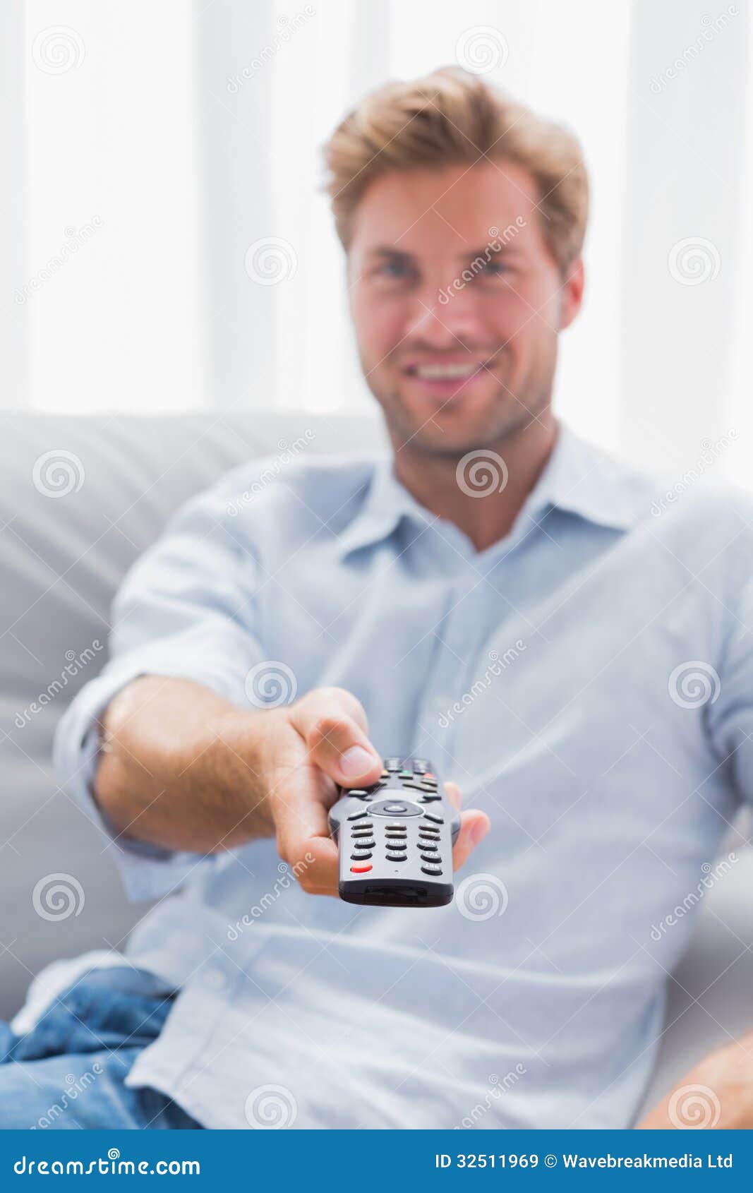 Man Pointing Remote Control Toward the Camera Stock Image - Image of ...